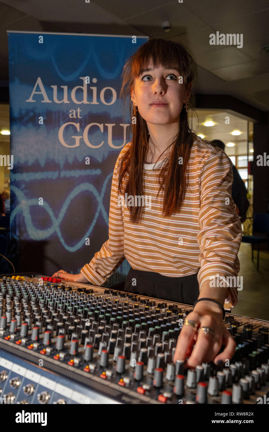 Sound Engineers working at mixing desk Stock Photo - Alamy