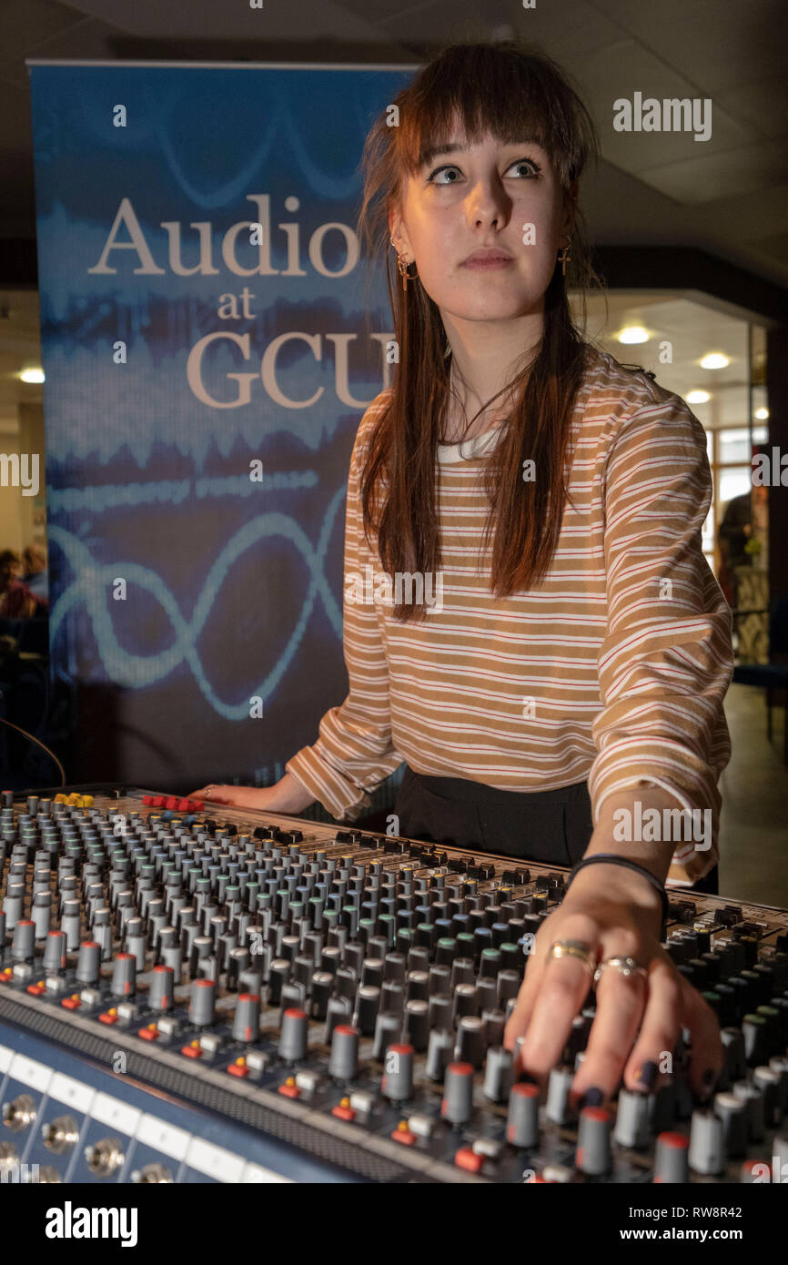 Sound Engineers working at mixing desk Stock Photo - Alamy