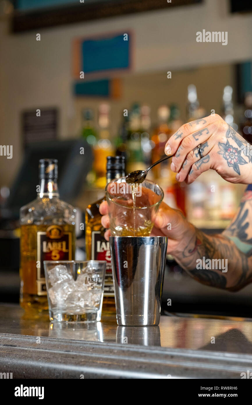 Whisky cocktail being made by barman hi-res stock photography and ...