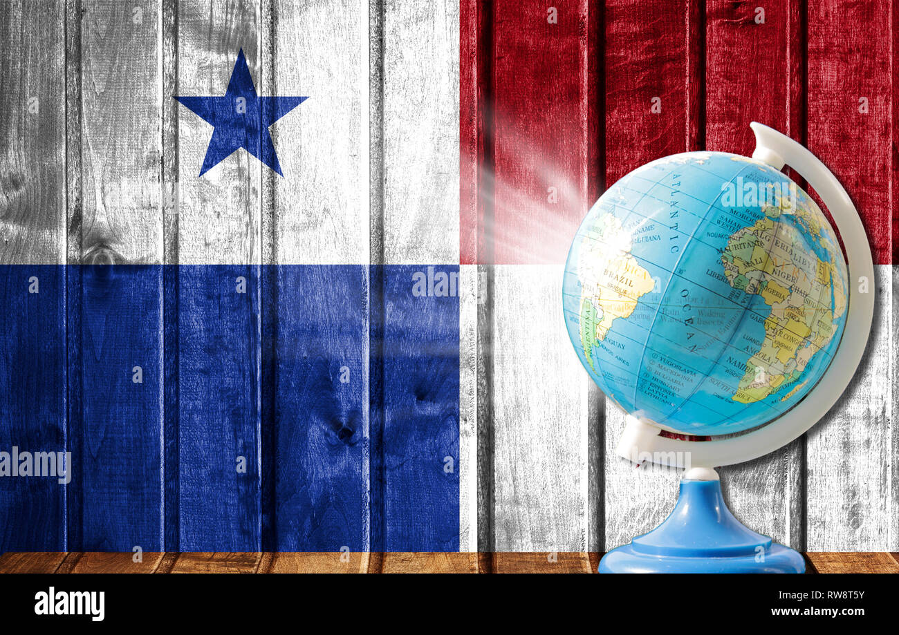 Globe with a world map on a wooden background with the image of the ...