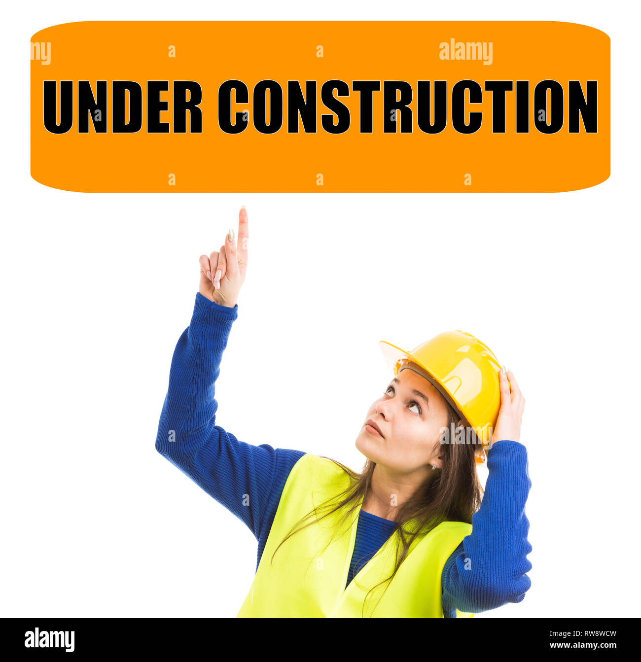 Young female construction worker pointing with index finger at under ...