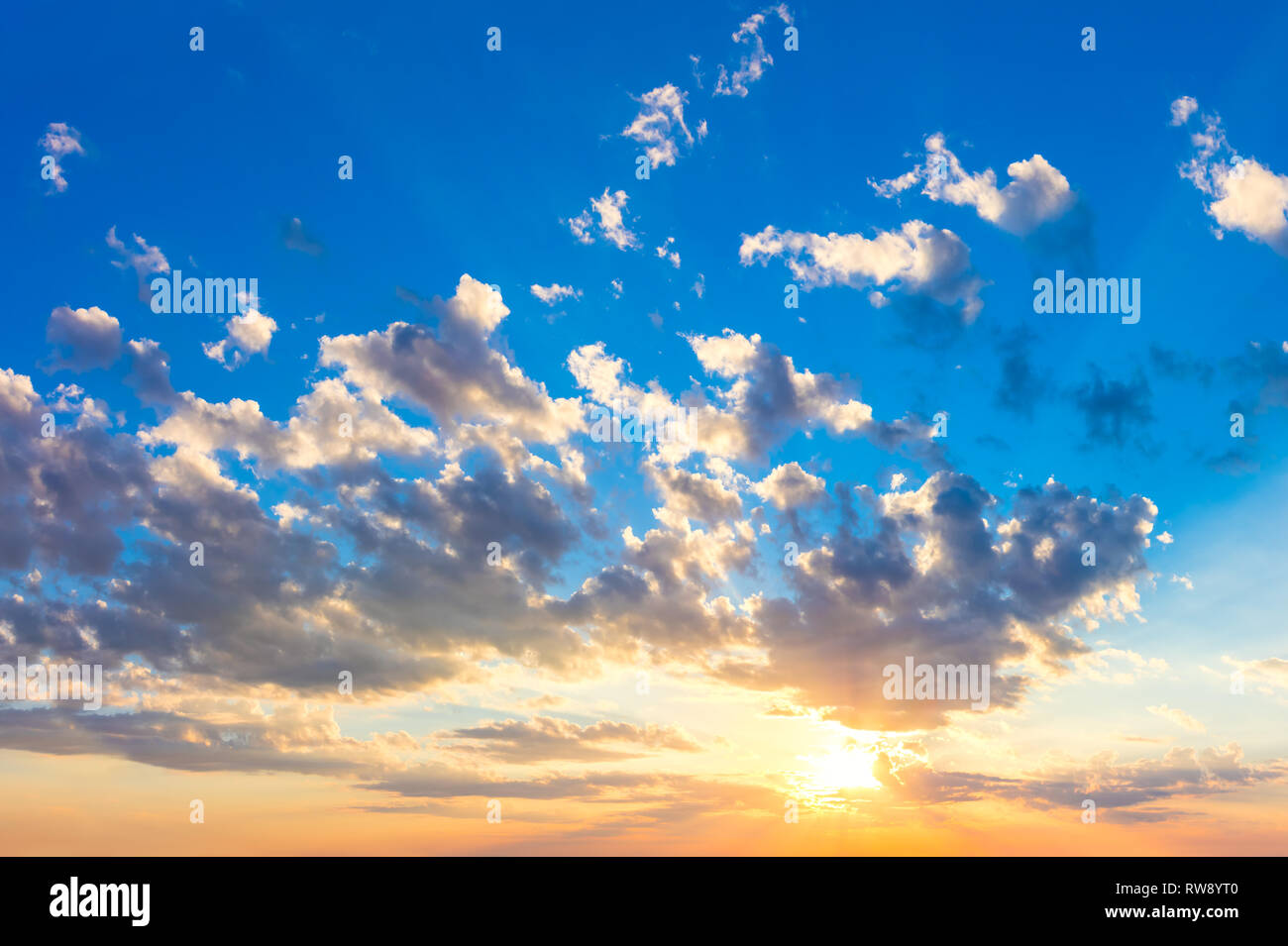 Amazing sunrise sundown sky with sun, sun rays and colorful clouds ...