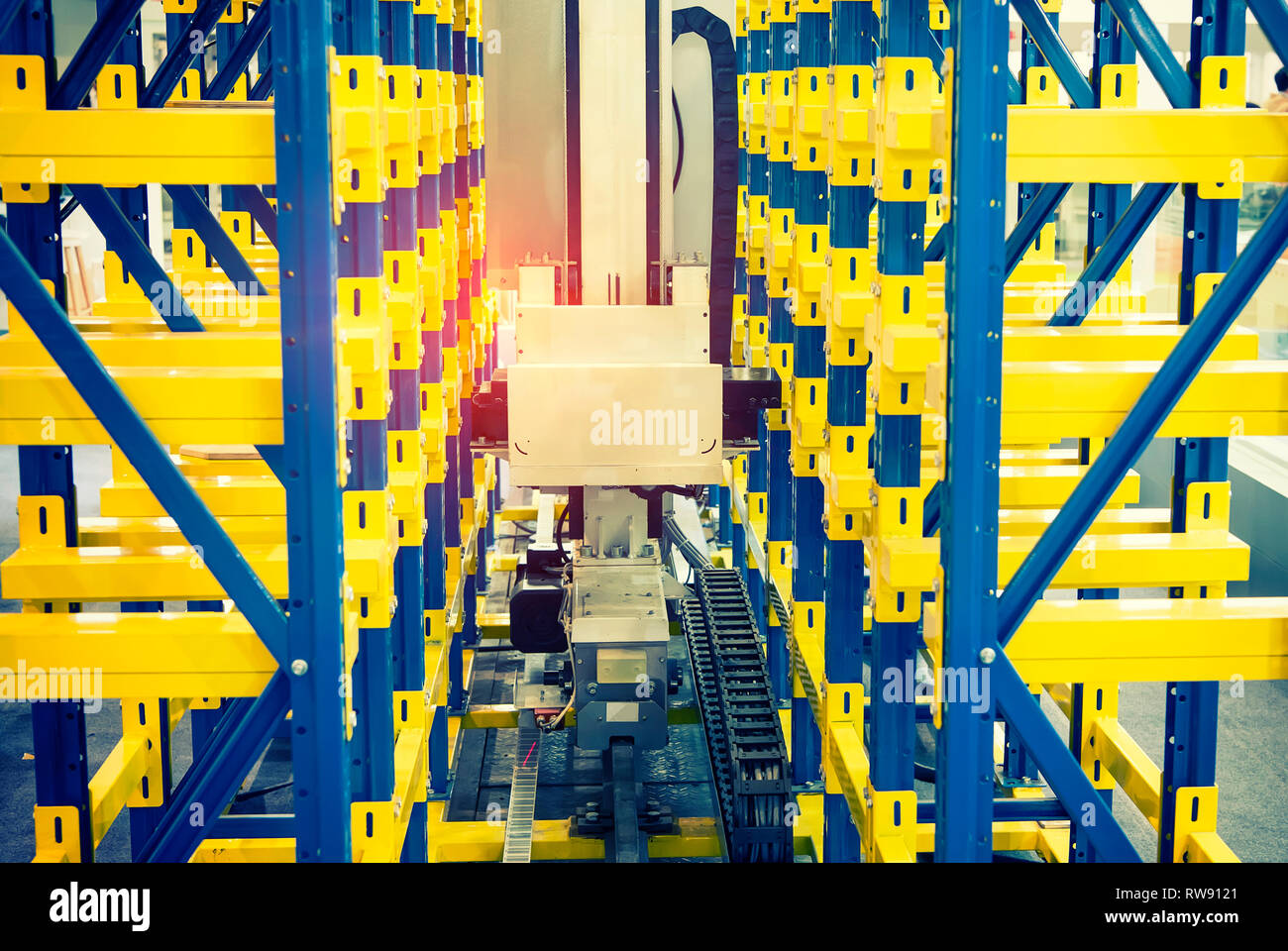 plastic boxes in the cells of the automated warehouse. Metal ...