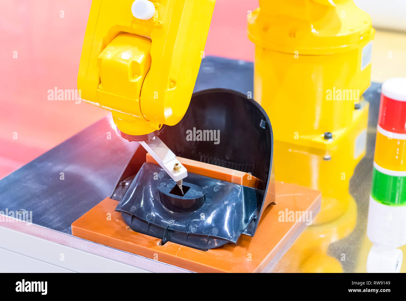 Robot holding glue syringe Injection Stock Photo - Alamy