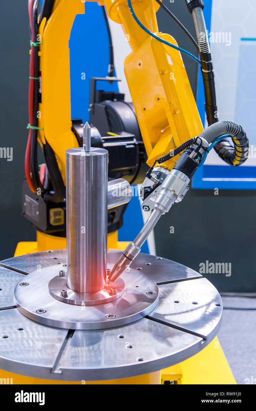 Welding robot in the process Stock Photo - Alamy
