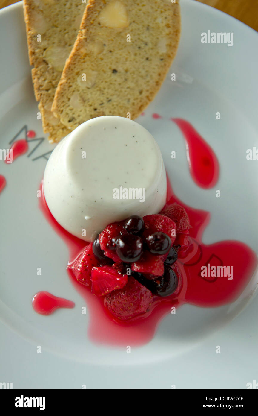 Vanilla panna cotta with a fruit compote Stock Photo - Alamy