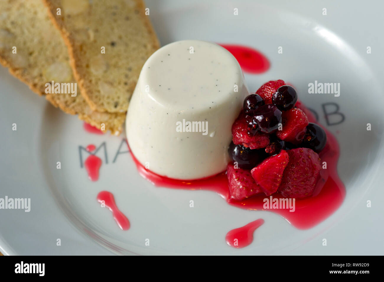 Vanilla panna cotta with a fruit compote Stock Photo - Alamy