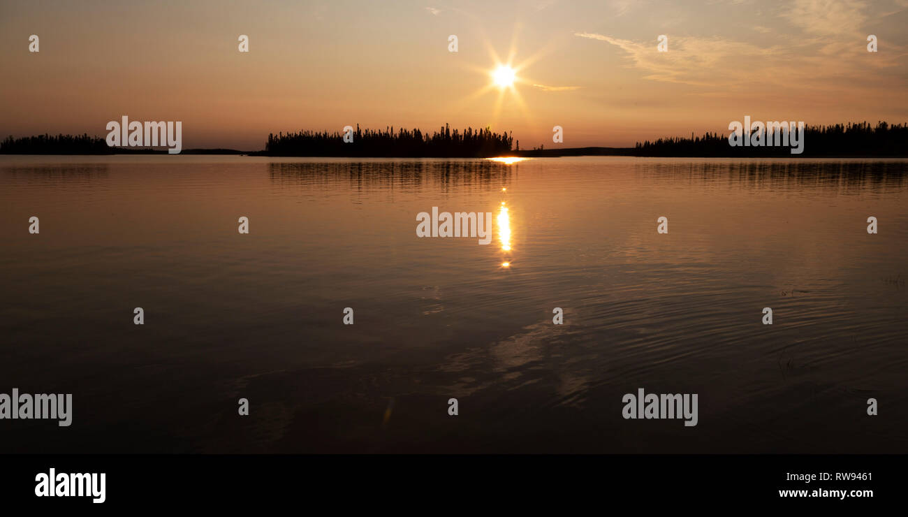 Sunrise over Lake Egenolf in northern Manitoba, Canada. The lake is a ...