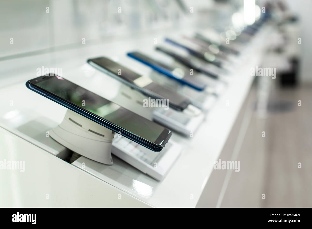 Smartphones on shelf in the store. Concept for communications and ...