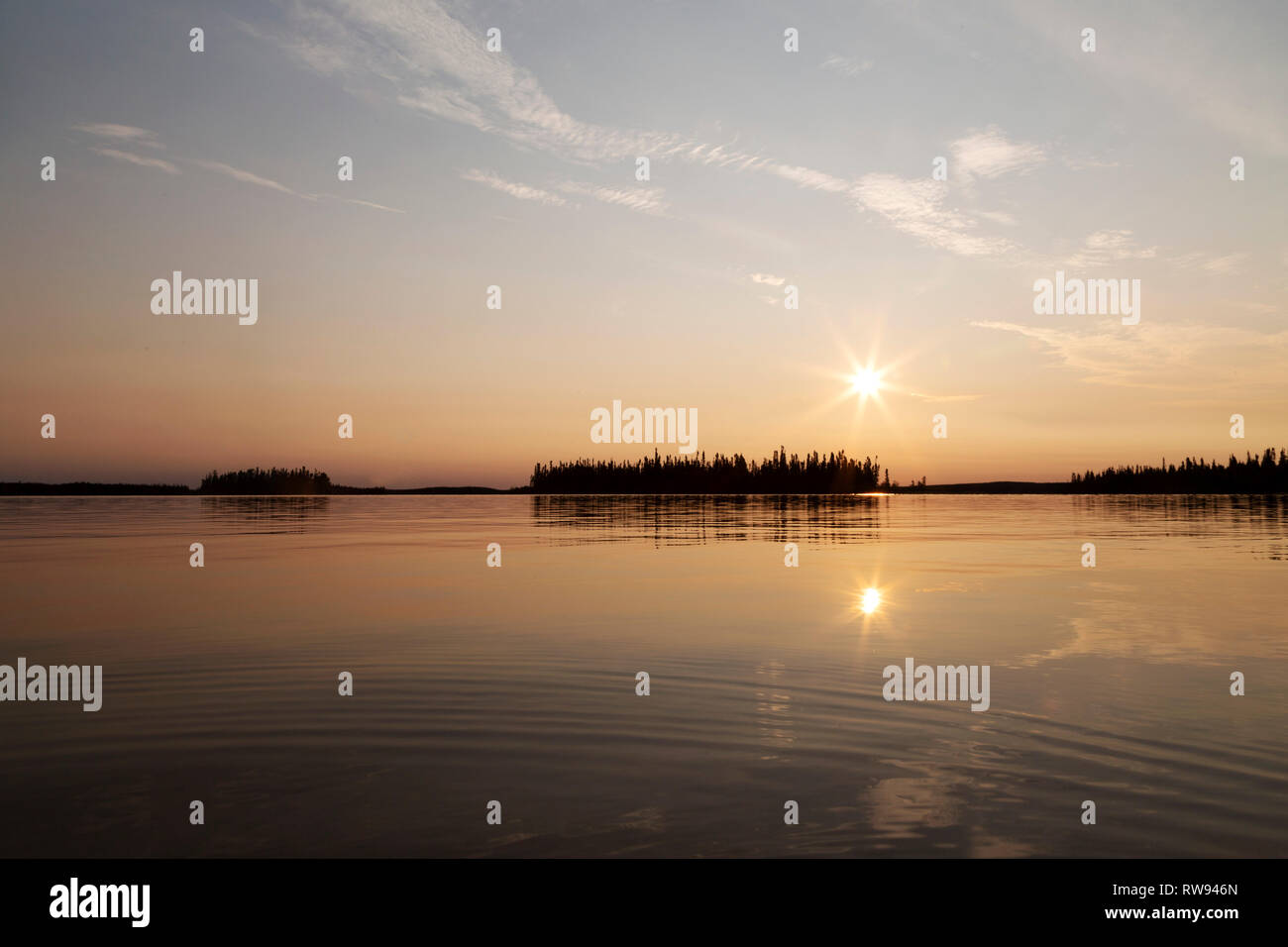 Sunrise over Lake Egenolf in northern Manitoba, Canada. The lake is a ...