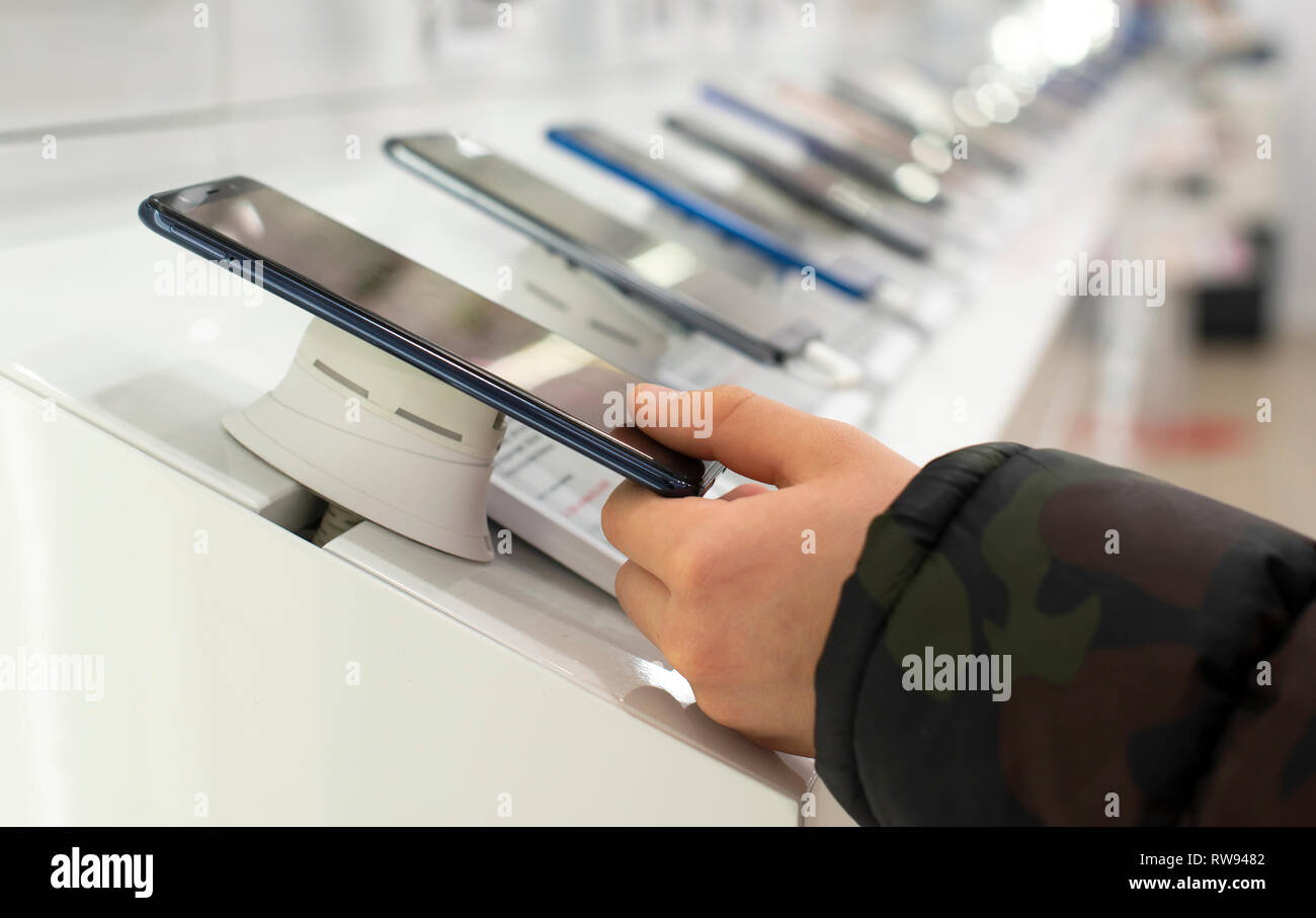 Smartphones on shelf in the store. Concept for communications and ...