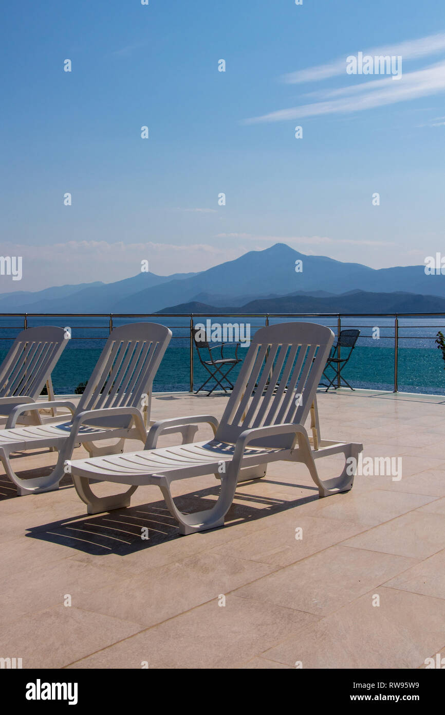 pool chairs overlooking ocean Stock Photo - Alamy