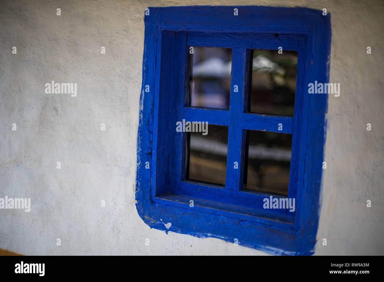 Color image of a blue window on an old house Stock Photo - Alamy