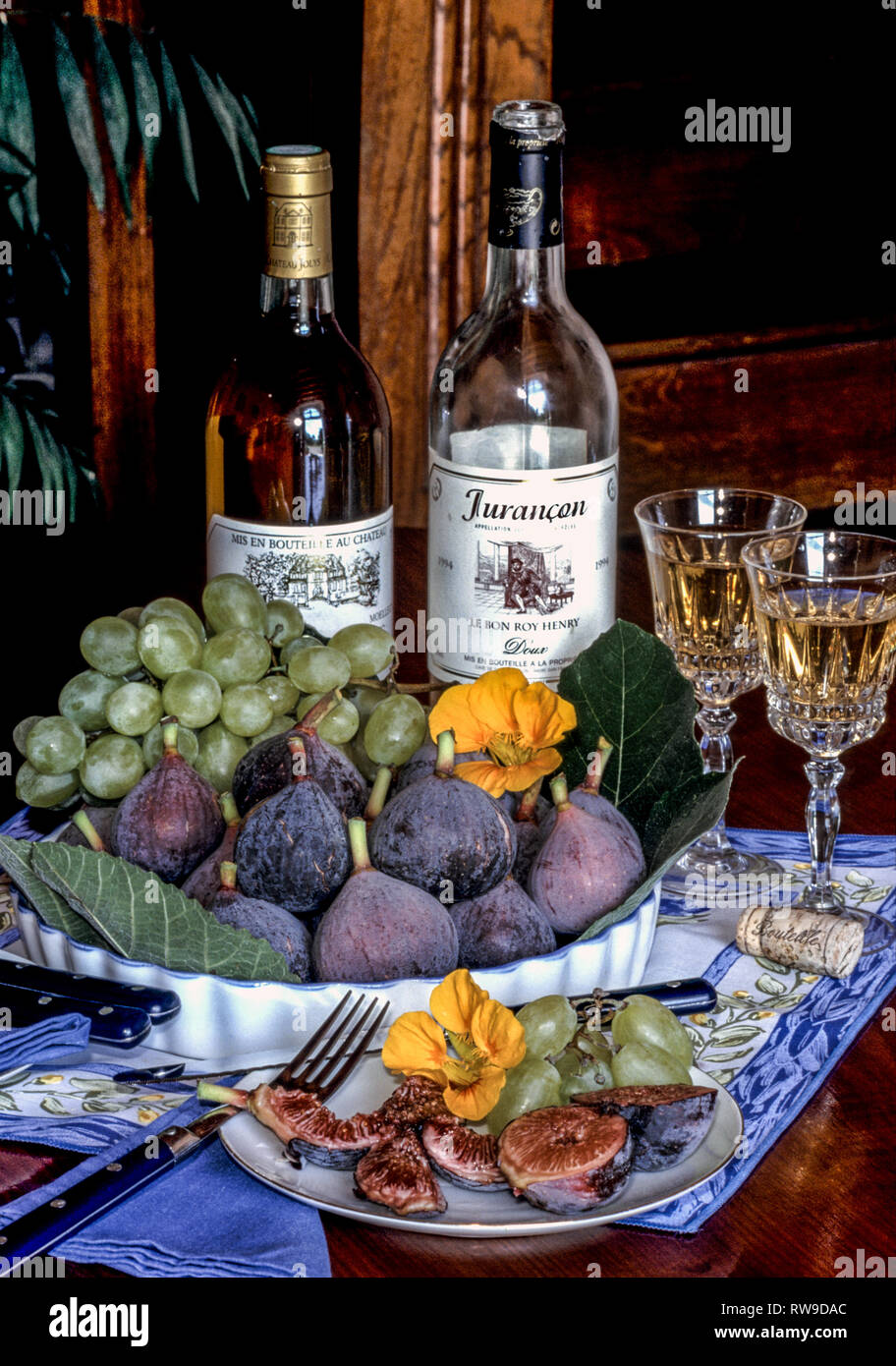 Lifestyle.The good life,Jurancon white wine,fresh figs and grapes with ...