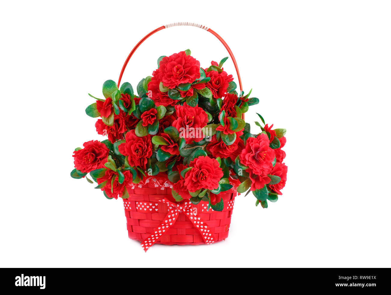 Red fabric flowers in wicker basket isolated on white background Stock ...