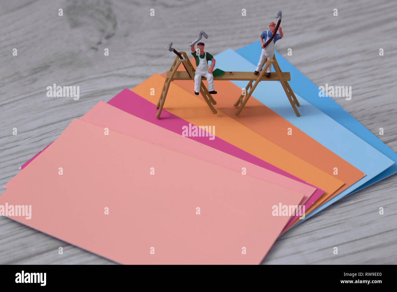 Colour paint swatch cards with miniature scale model painters and ...