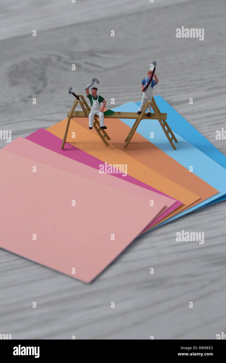 Colour paint swatch cards with miniature scale model painters and ...