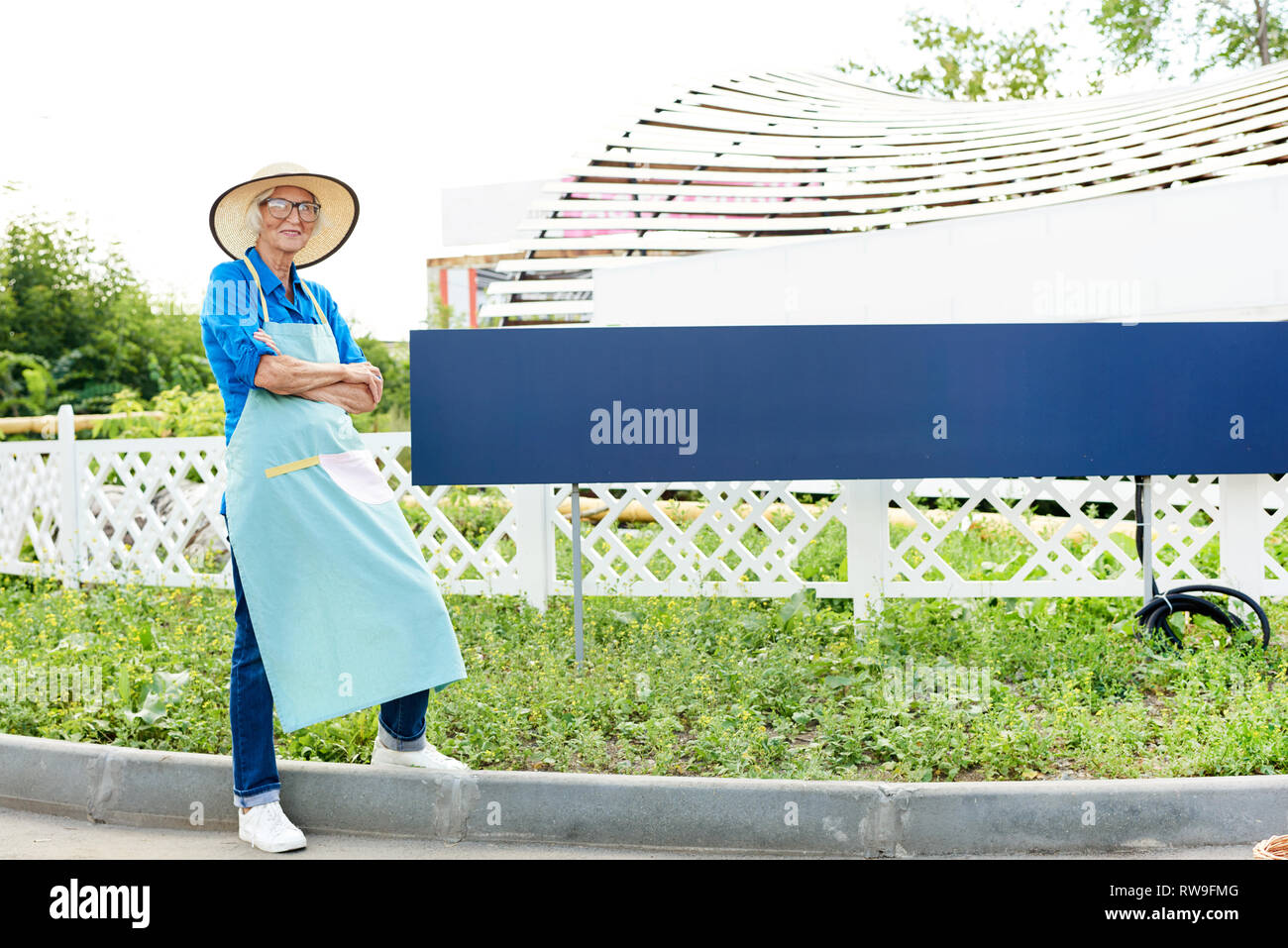 Senior Gardener Posing by Plantation Stock Photo - Alamy