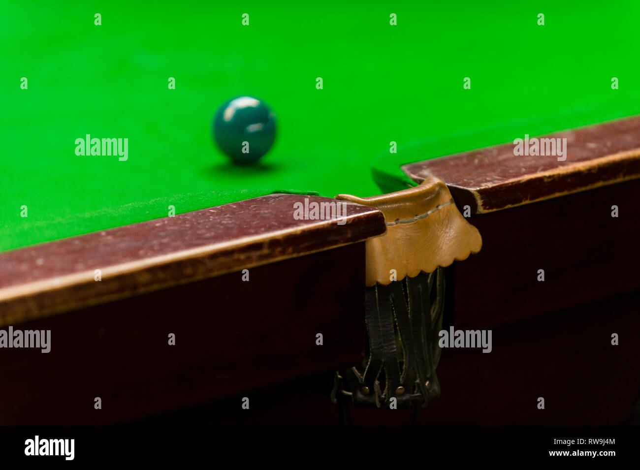 The net corner pocket of an old billiard table Stock Photo - Alamy