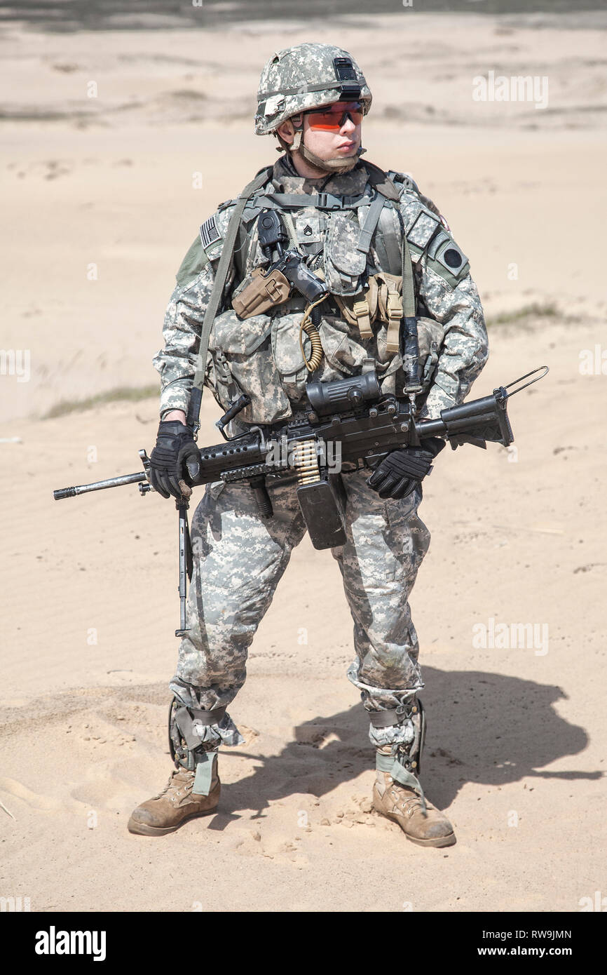 Portrait of United States airborne infantry corporal with machine gun ...