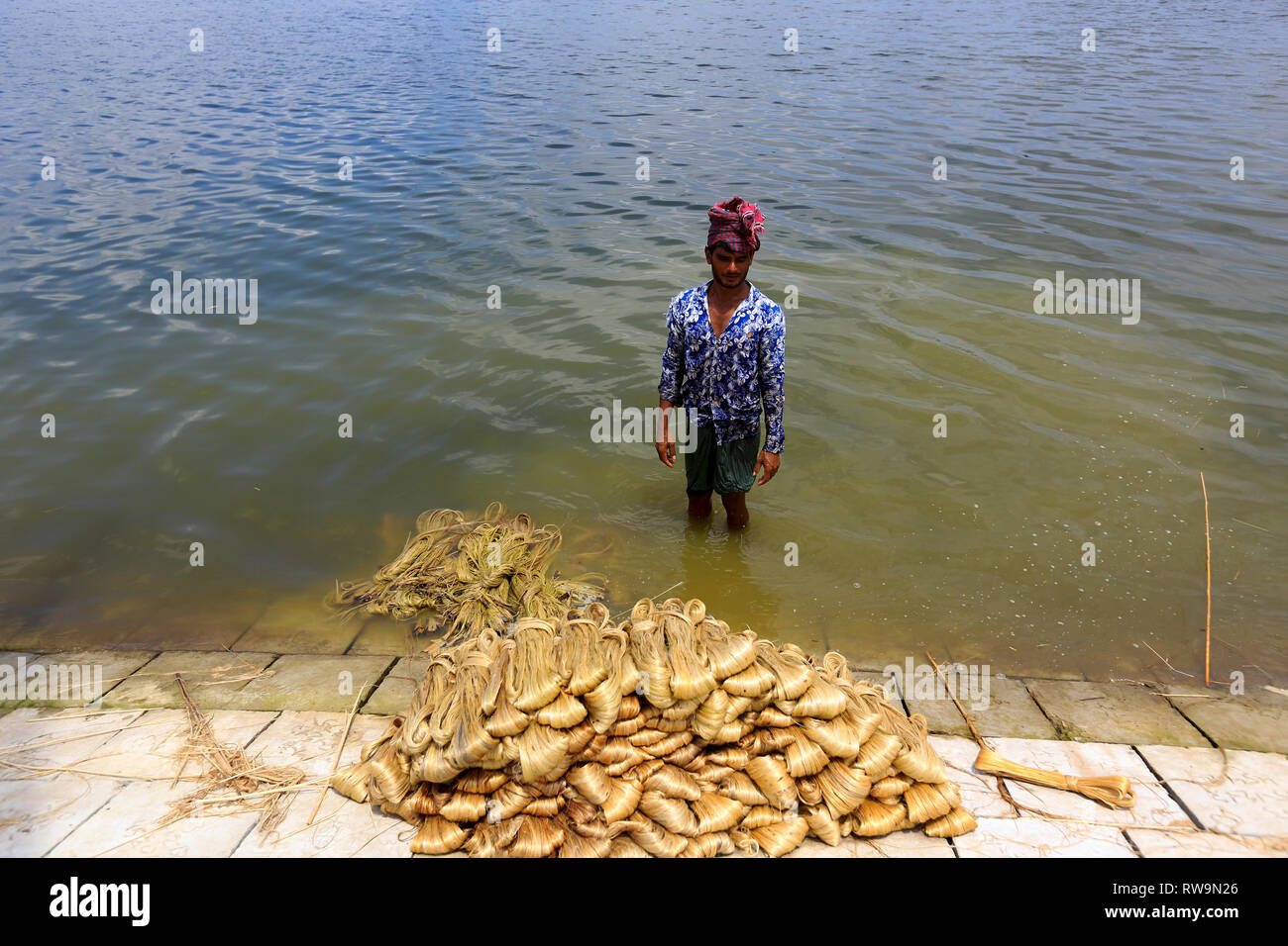 Farmer washing jute fibres in hi-res stock photography and images - Alamy