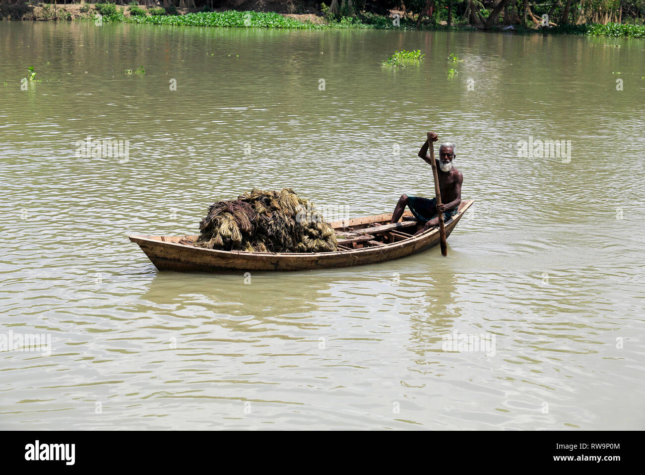 A boat loaded with raw jute fibres at Faridpur, Bangladesh Stock Photo ...
