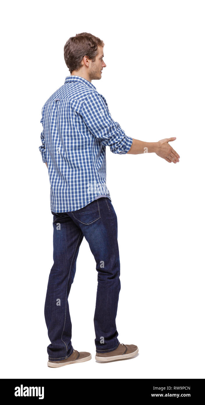 Back view of a walking businessman who stretches his hand for a ...