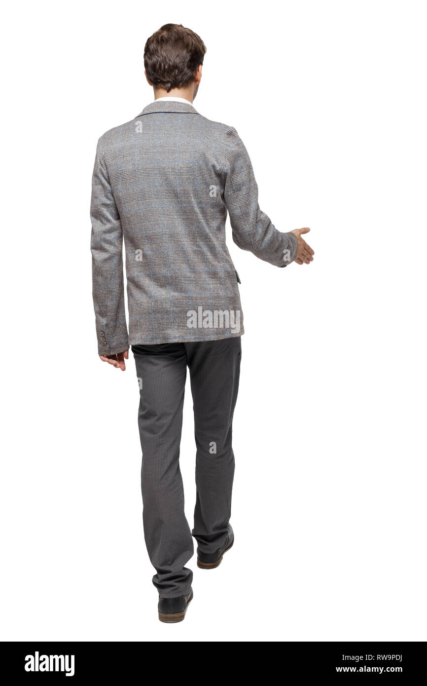 Back view of a walking businessman who stretches his hand for a ...