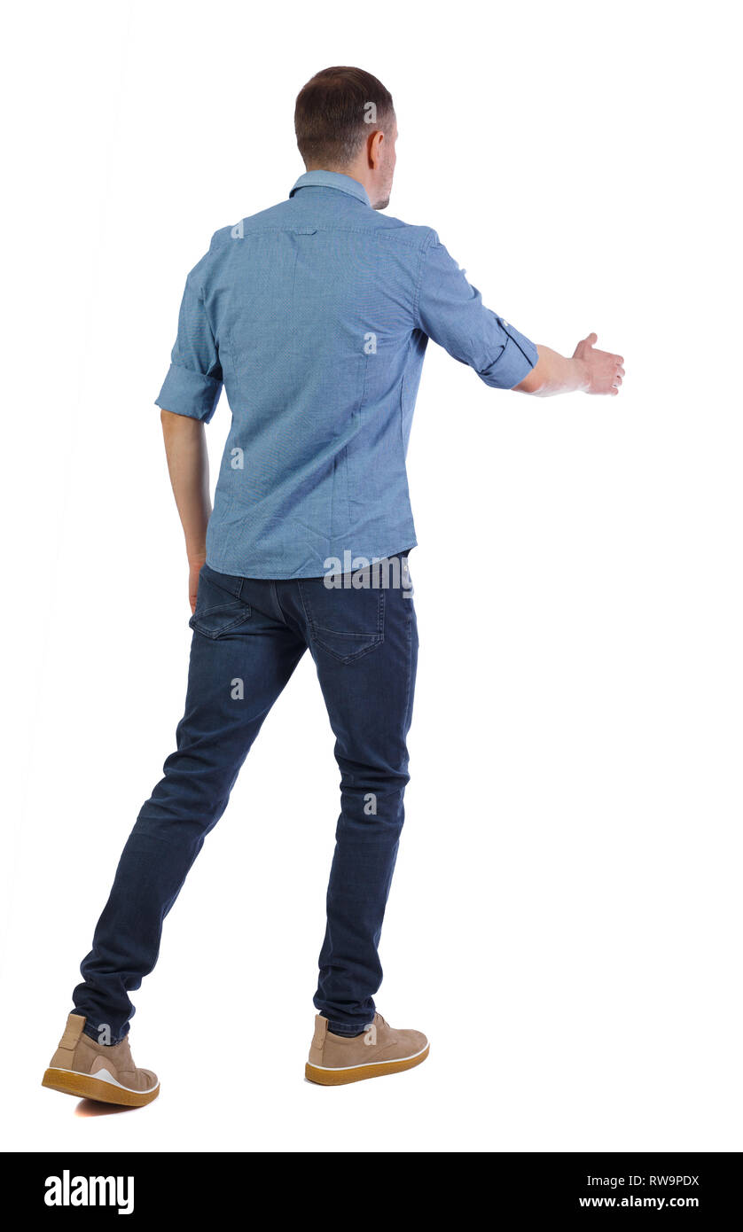 Back view of a walking businessman who stretches his hand for a ...