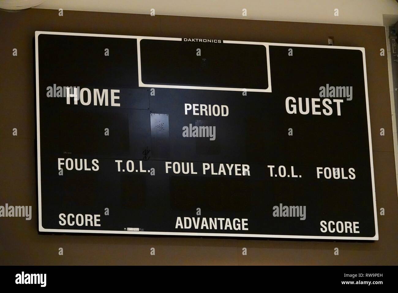 A scoreboard is turned off on a gym wall Stock Photo - Alamy