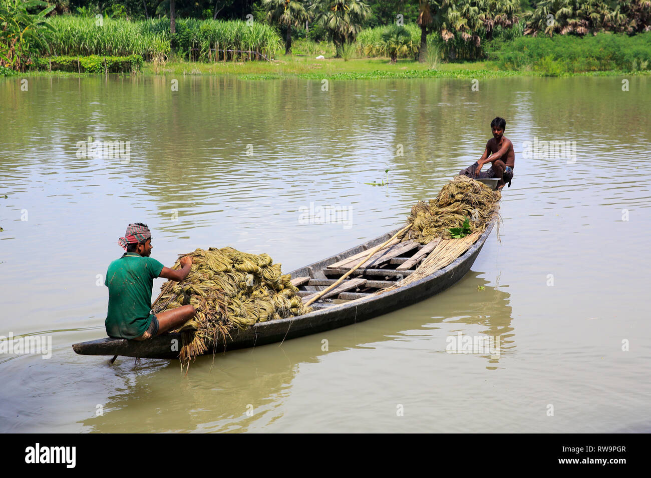 A boat loaded with raw jute fibres at Faridpur, Bangladesh Stock Photo ...