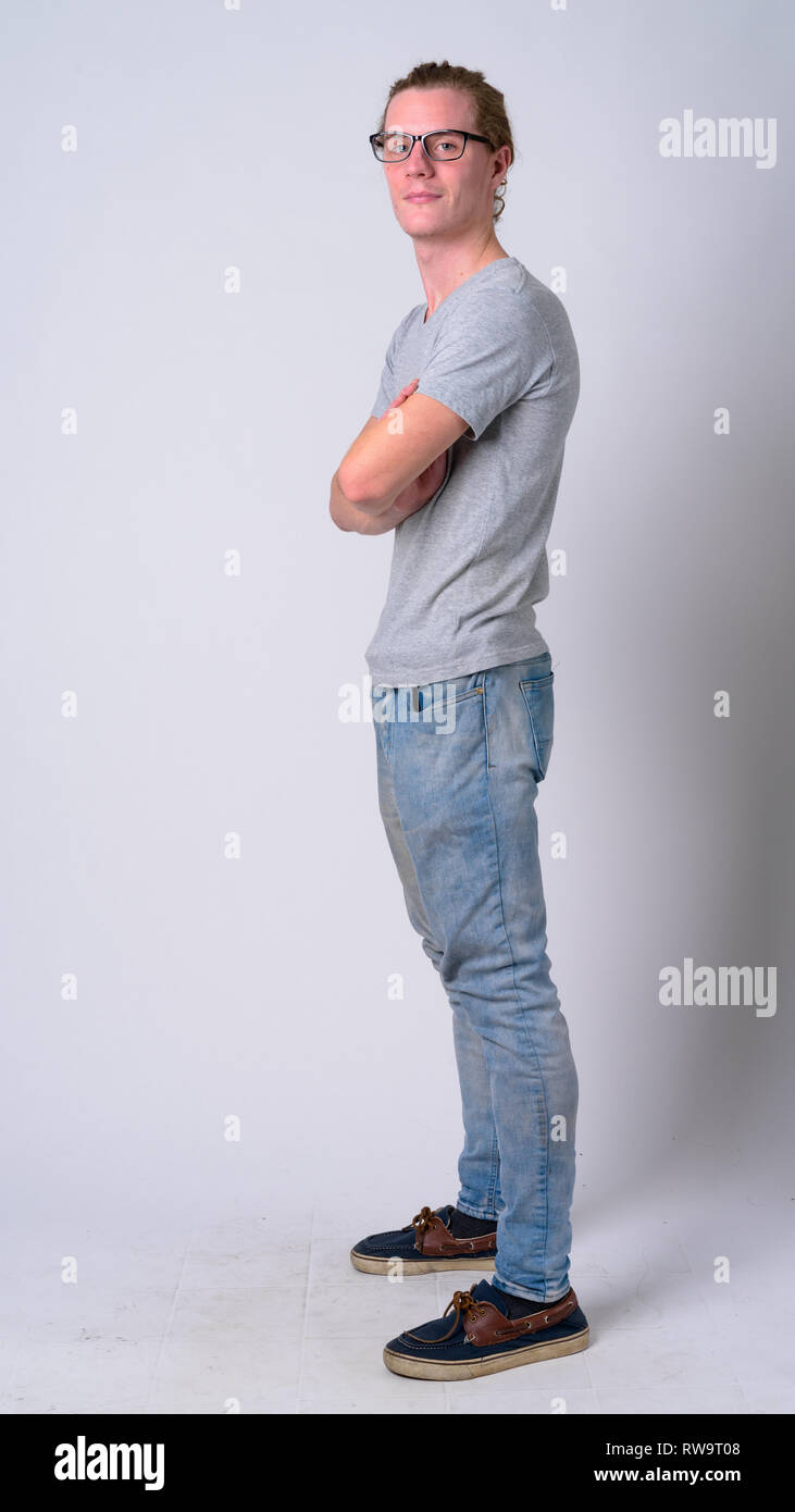 Full body shot profile view of young handsome man with eyeglasses ...