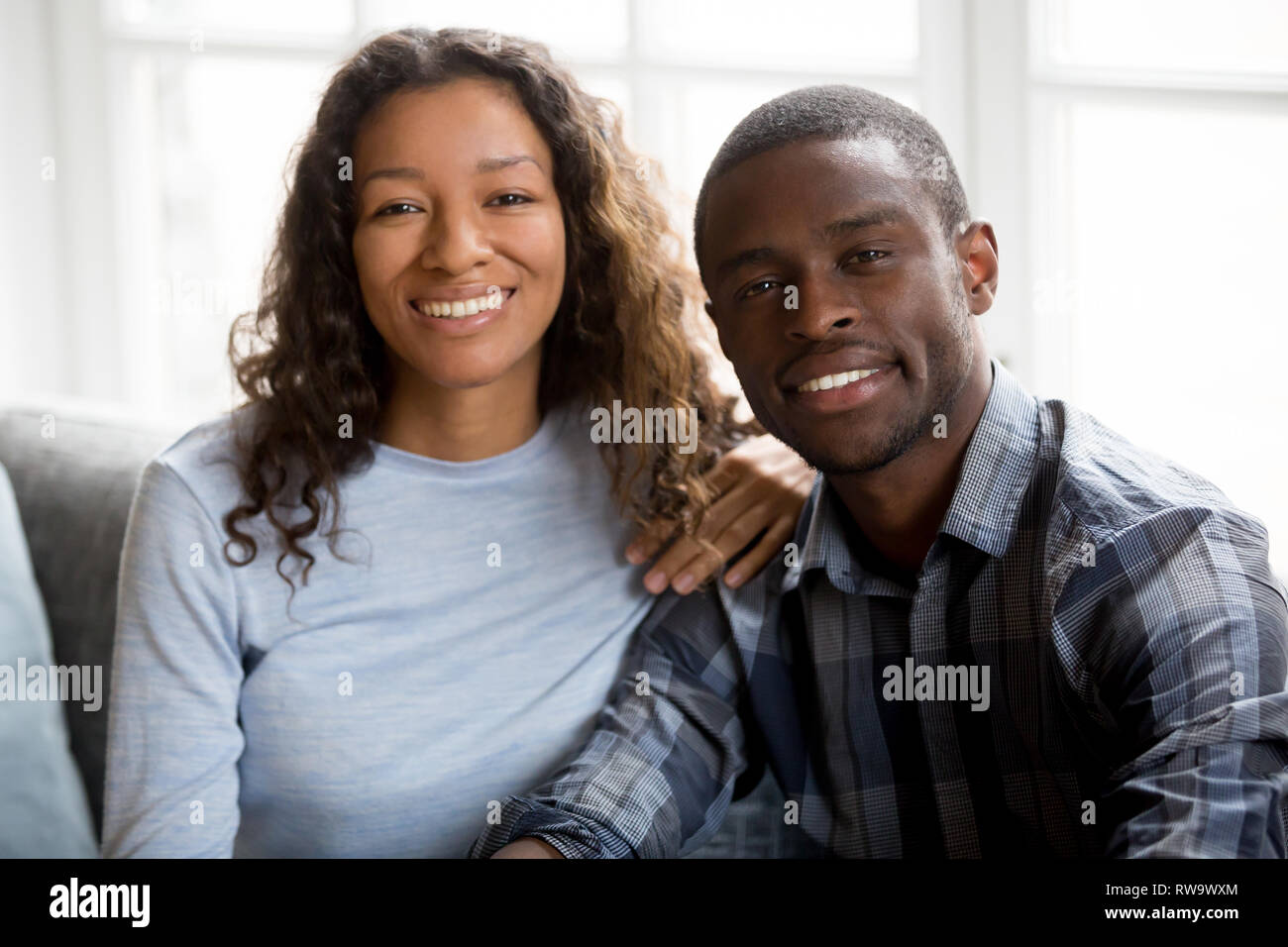 Portrait of happy mixed race couple posing for picture Stock Photo - Alamy