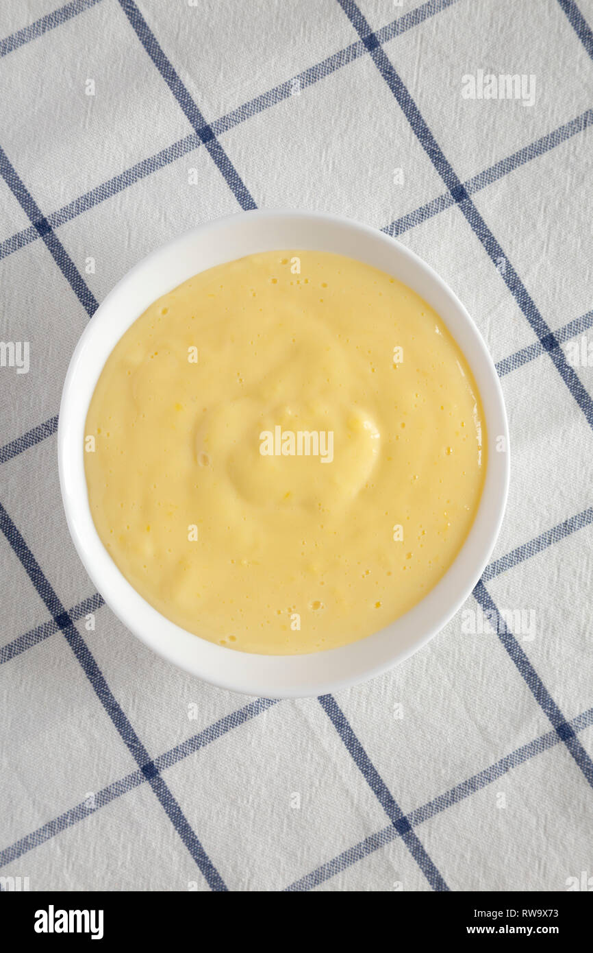 Homemade vanilla custard pudding on cloth, top view. Overhead, from ...