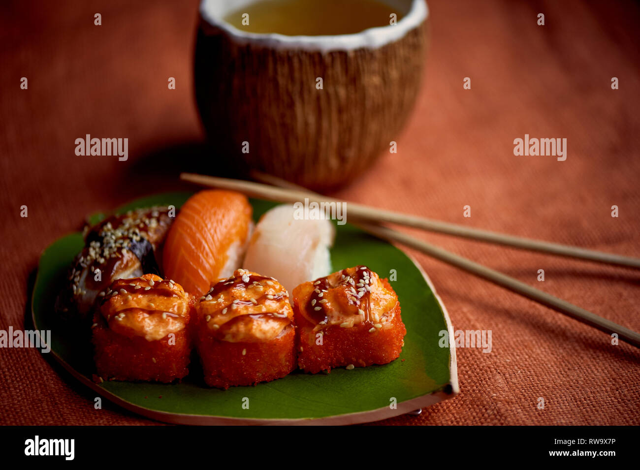 Japanese traditional cuisine on handmade ceramics.Plate in the form of ...