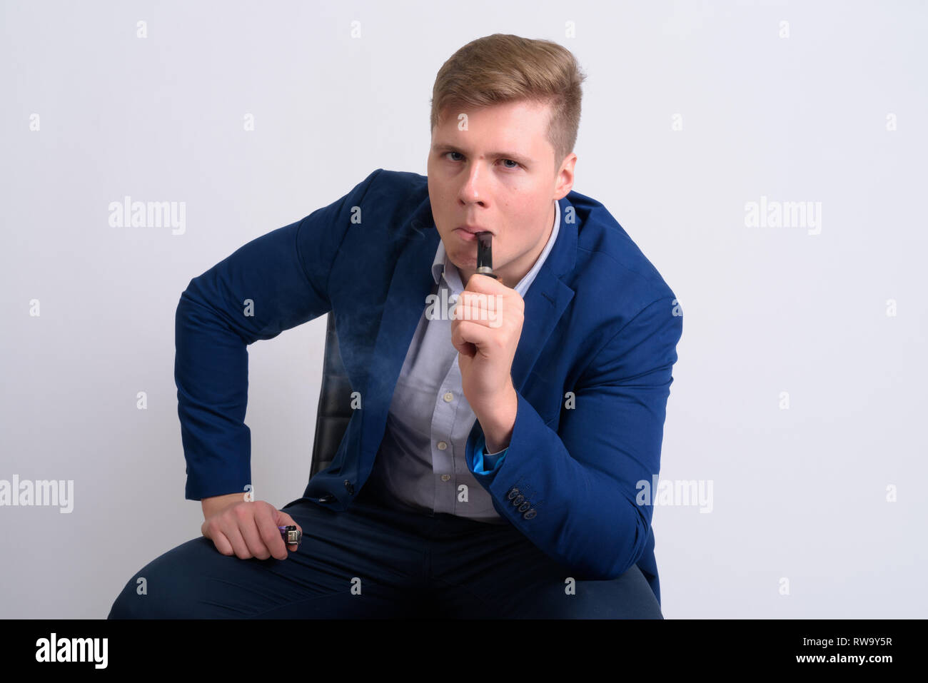 Retro businessman sitting hi-res stock photography and images - Alamy