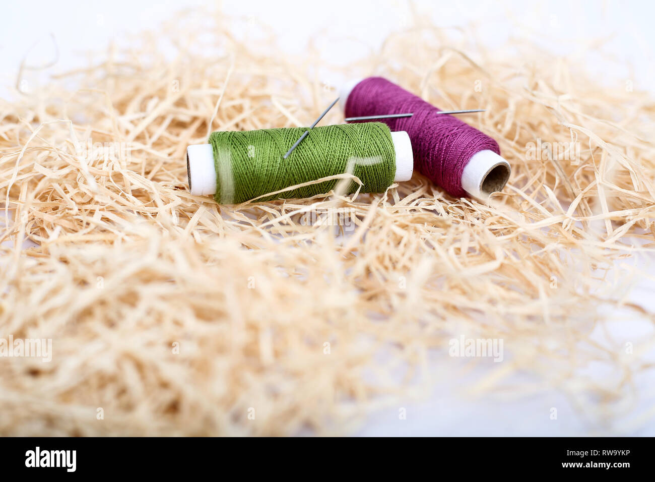 Spool of two thread with needle. Isolated on the white background Stock ...