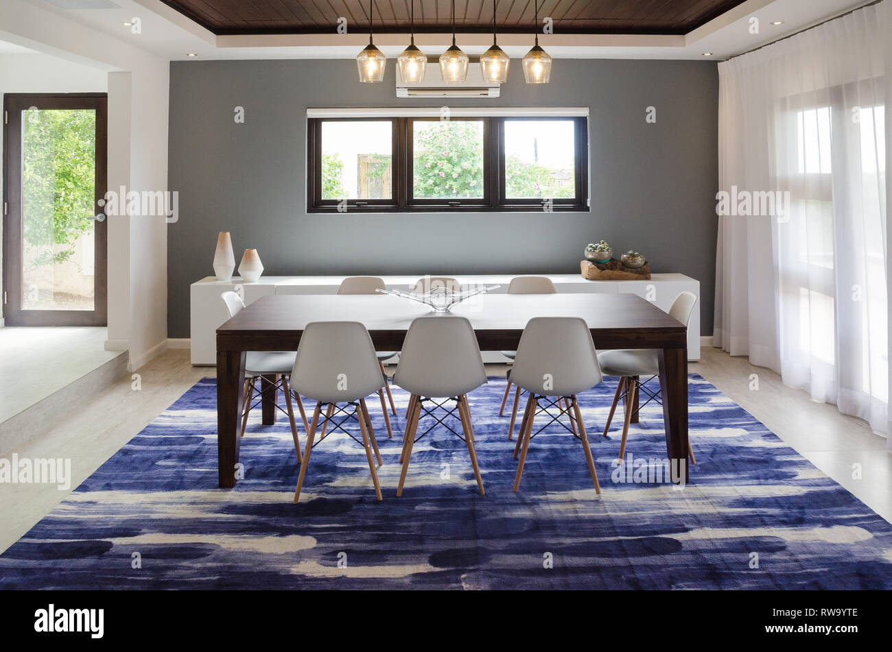Modern open dining room area filled with natural light Stock Photo - Alamy