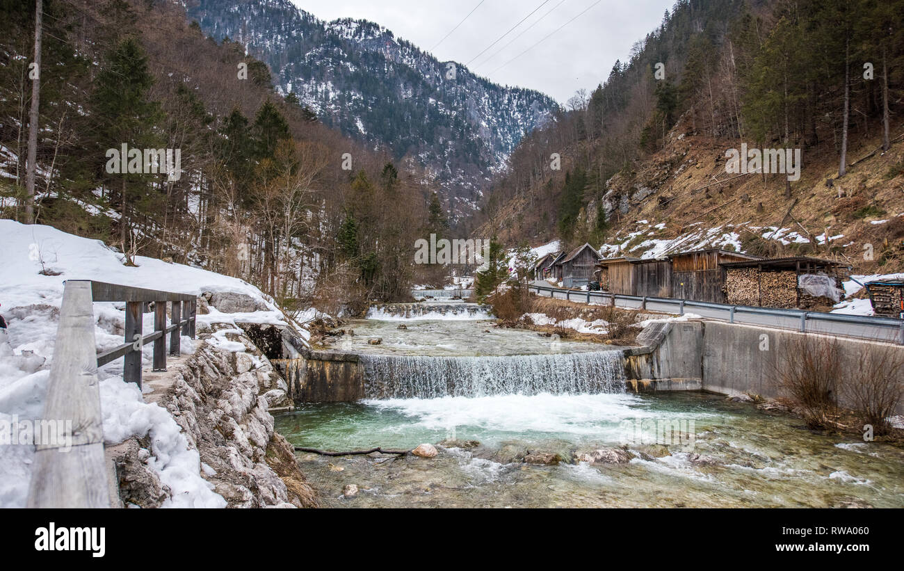 Mountain melt water cascades over waterfalls from the mountains around ...