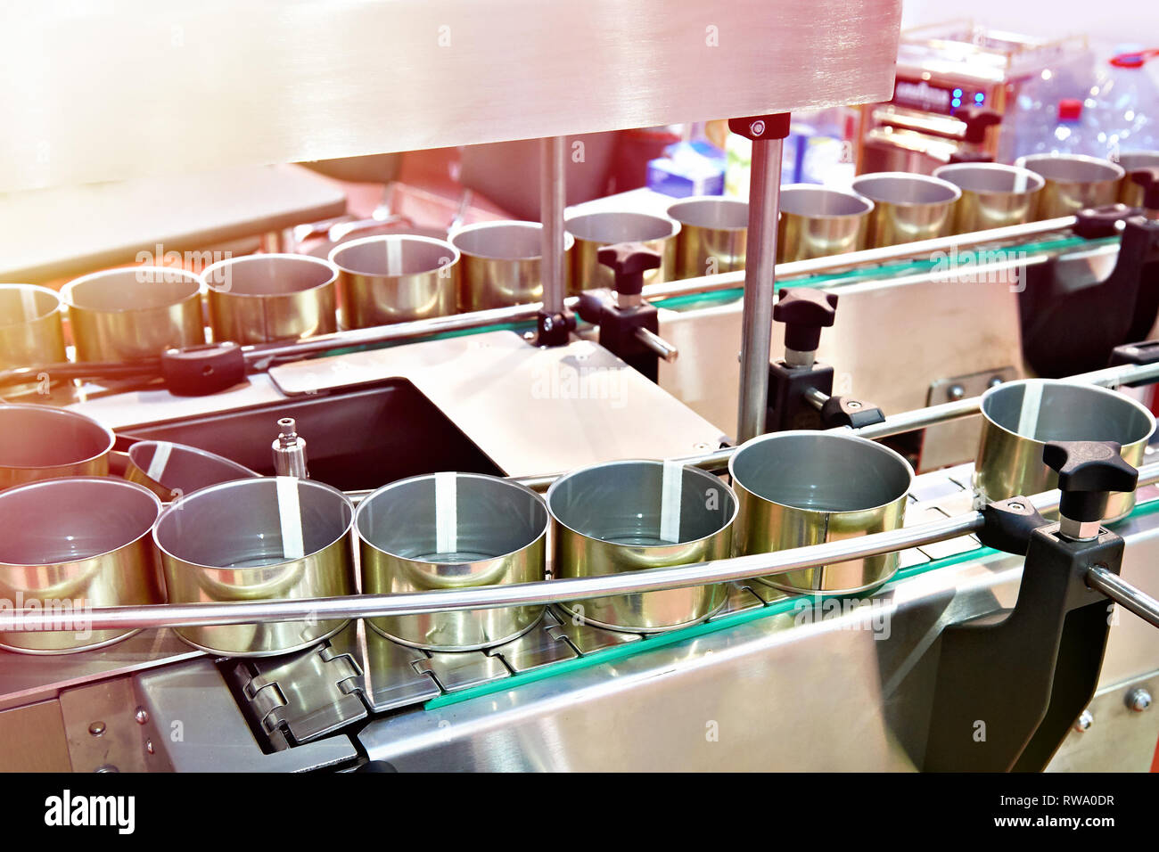 Empty cans on the conveyor of a food factory Stock Photo - Alamy