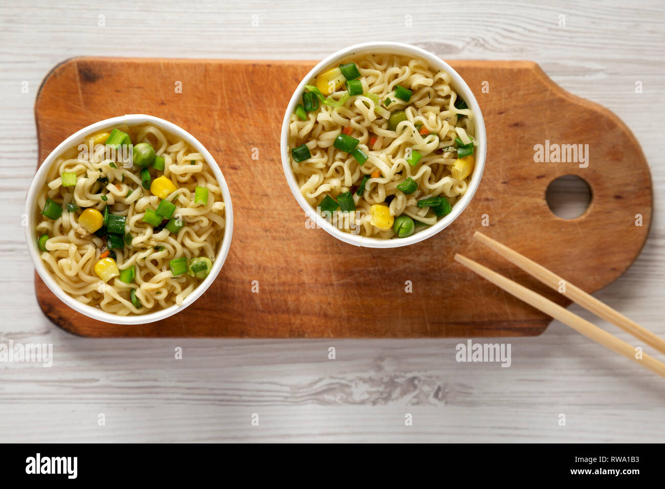 Top view, prepared instant noodles with beef flavoring in cups over ...