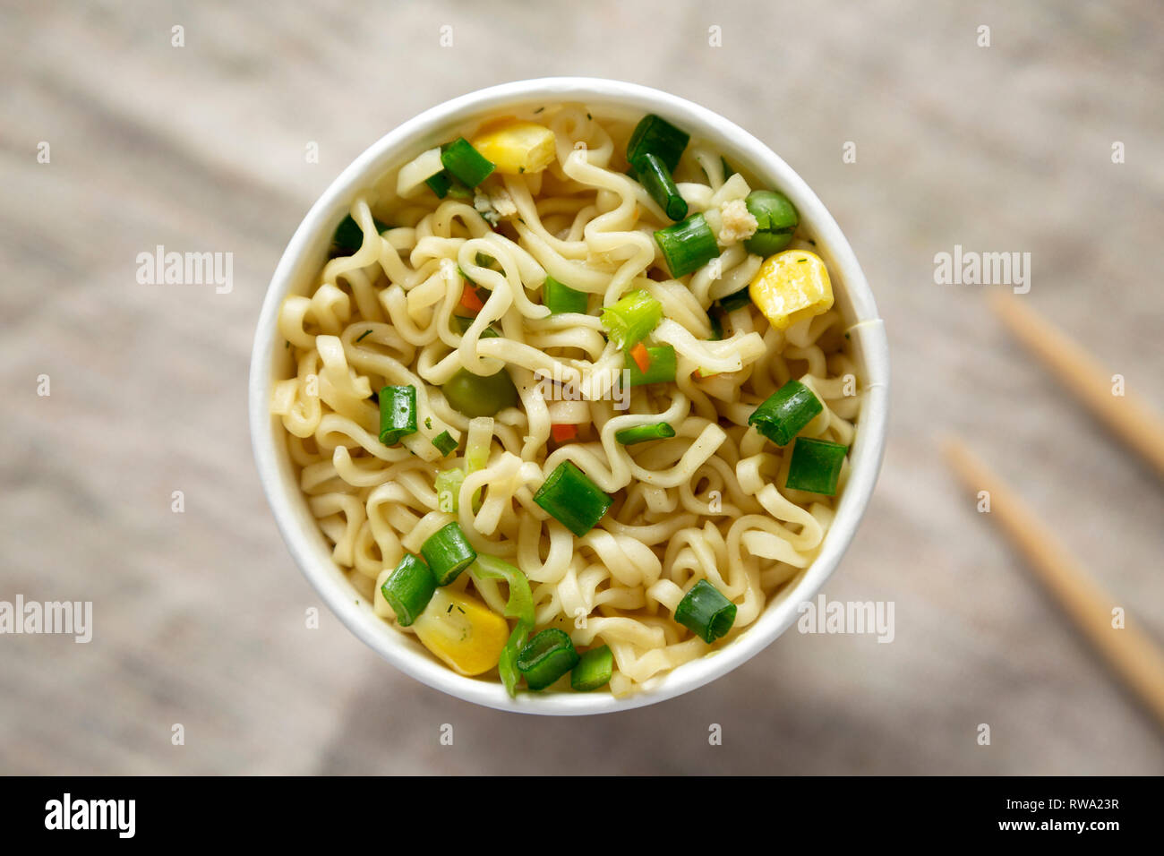 Top view, prepared instant noodles with beef flavoring in a cup. Flat ...