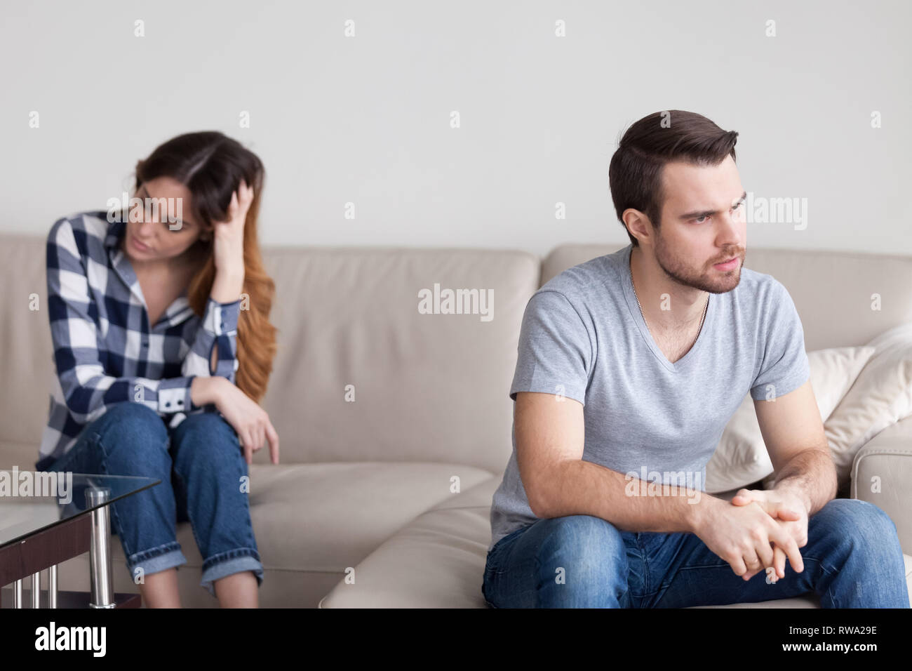 Sad angry husband ignoring avoiding talk to cheating bad wife Stock ...