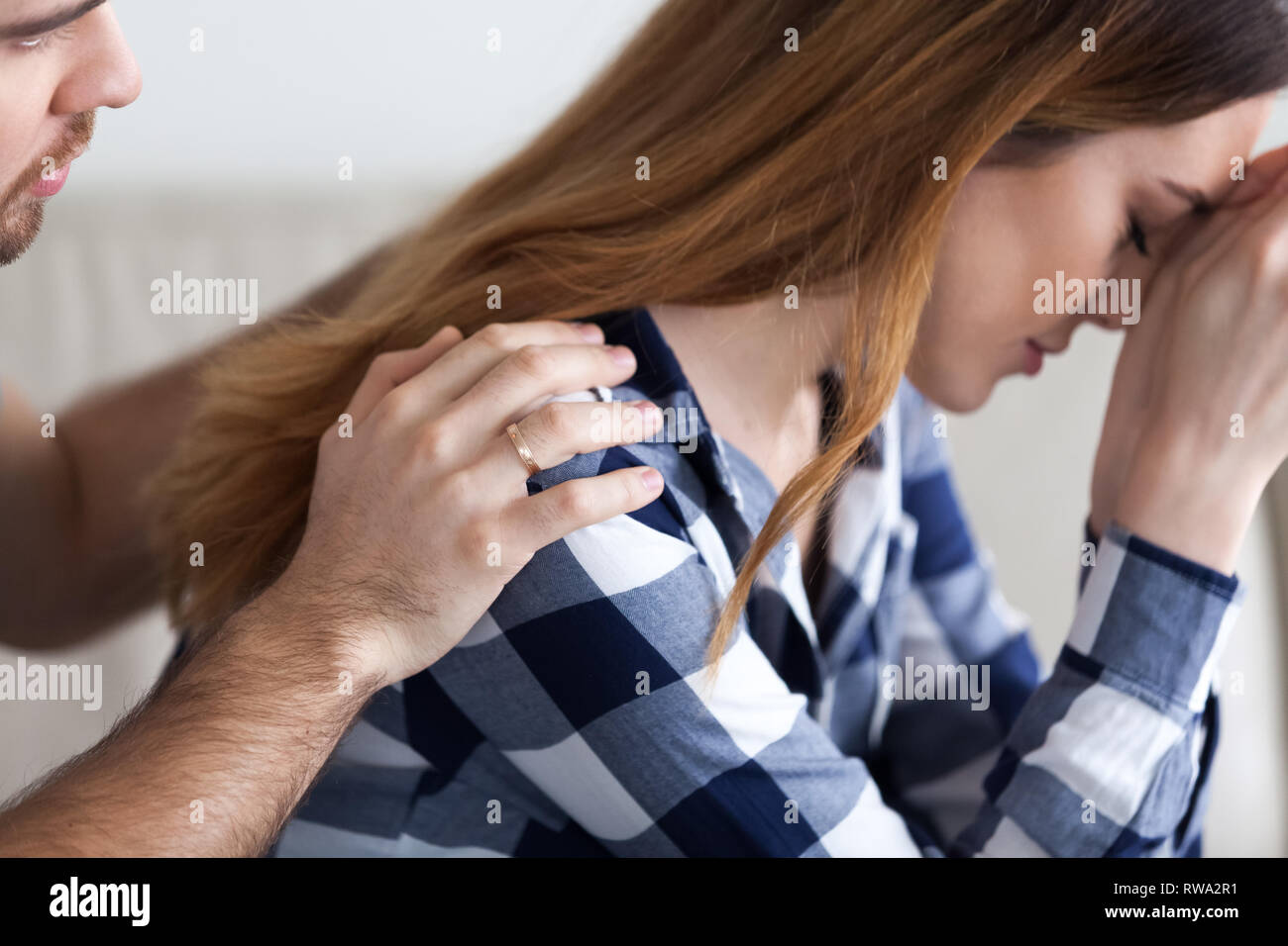 Husband consoling sad wife hi-res stock photography and images - Alamy