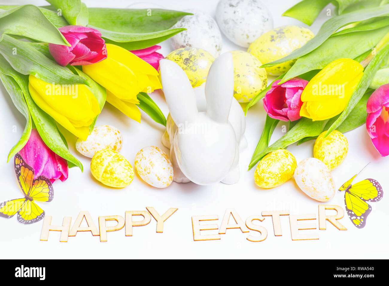 Easter white bunny on a white background with Easter eggs and fresh ...