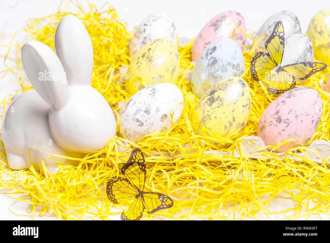 Happy Easter. Easter white bunny on a white background with Easter eggs ...
