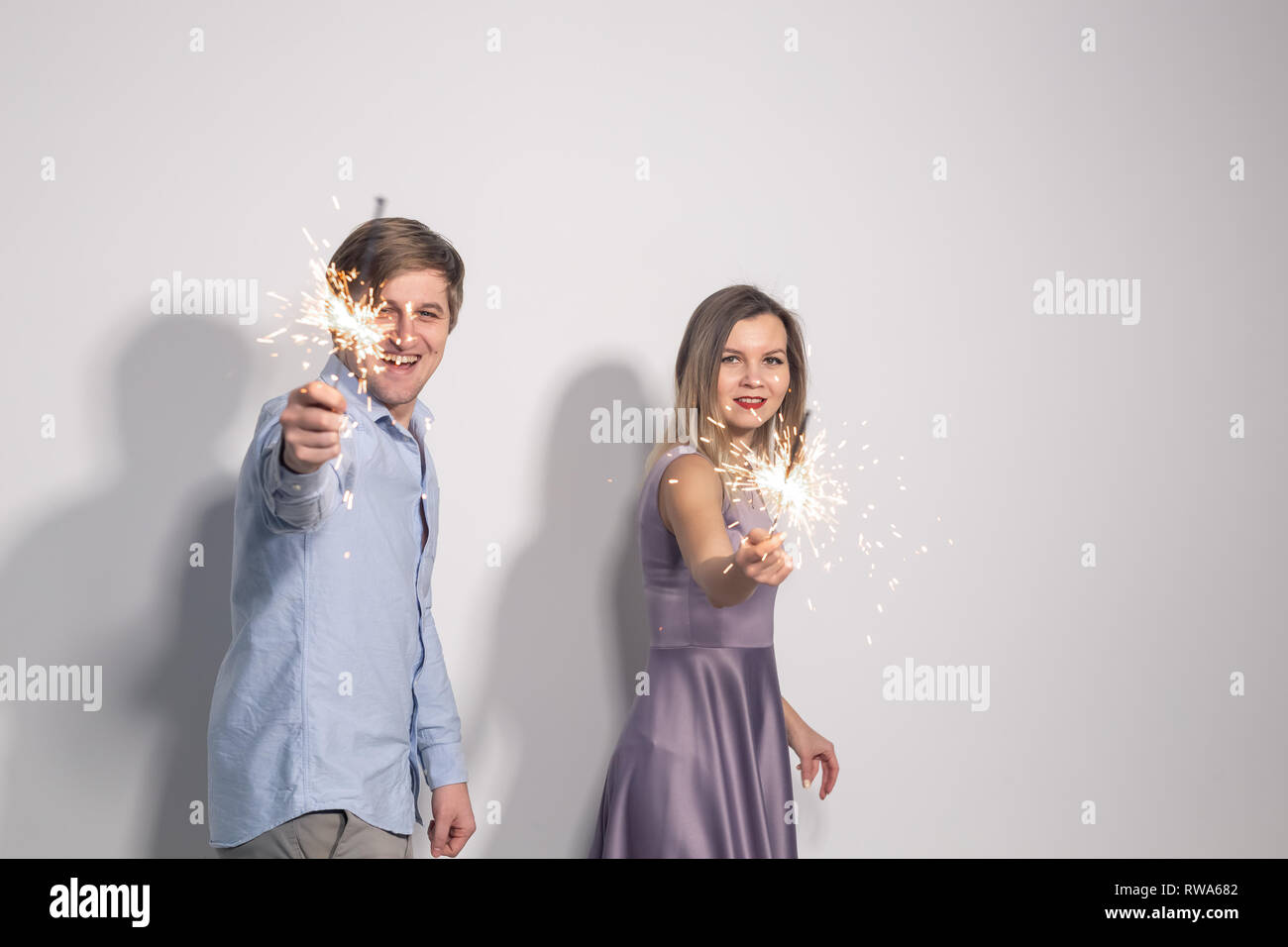 Fun, love and holiday concept - man and woman fooling around with ...