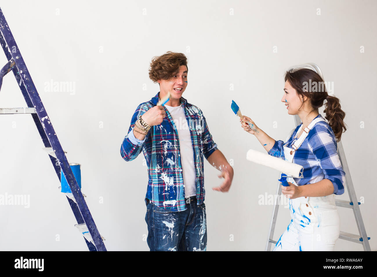 Conflict, repair and renovation concept - Young woman and man with ...