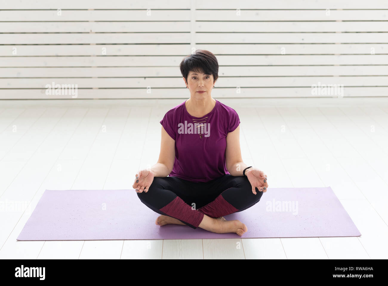 Harmony, people concept - middle aged woman doing yoga meditation Stock ...
