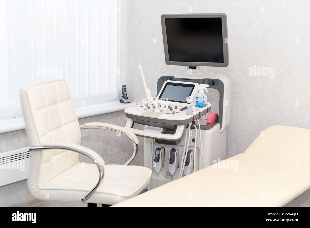 Interior of examination room with ultrasonography machine in hospital ...